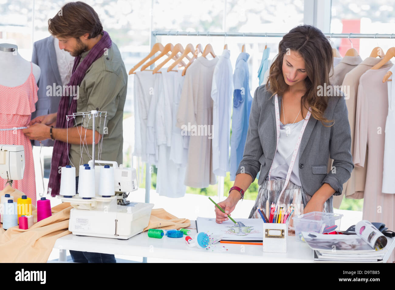 Fashion designers working Stock Photo - Alamy