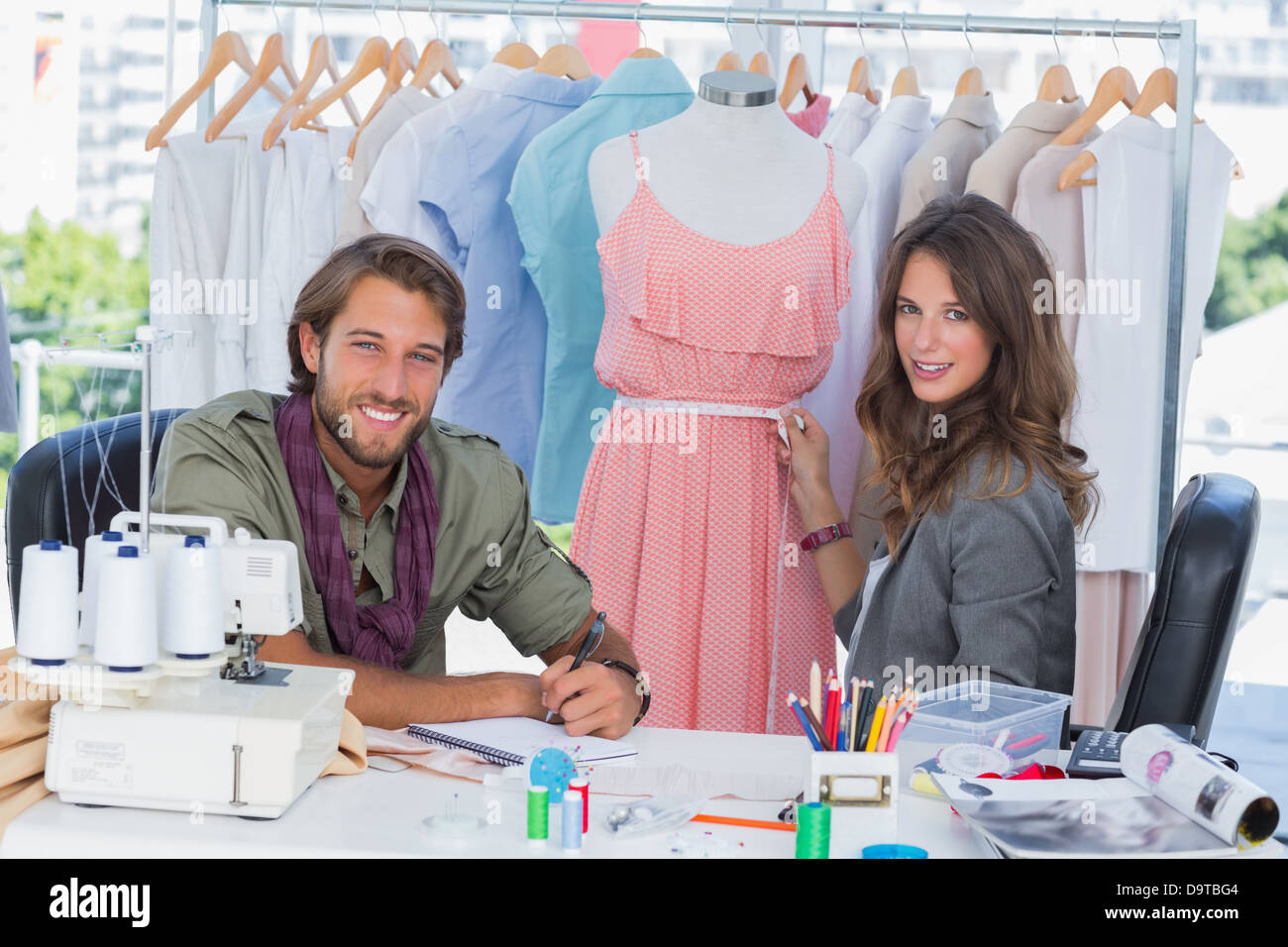 Fashion designers smiling to the camera Stock Photo - Alamy Fashion designers smiling to the camera Stock Photo - Alamy
