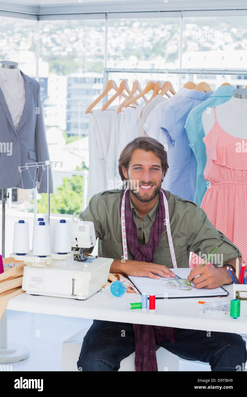 Handsome fashion designer smiling to the camera Stock Photo - Alamy