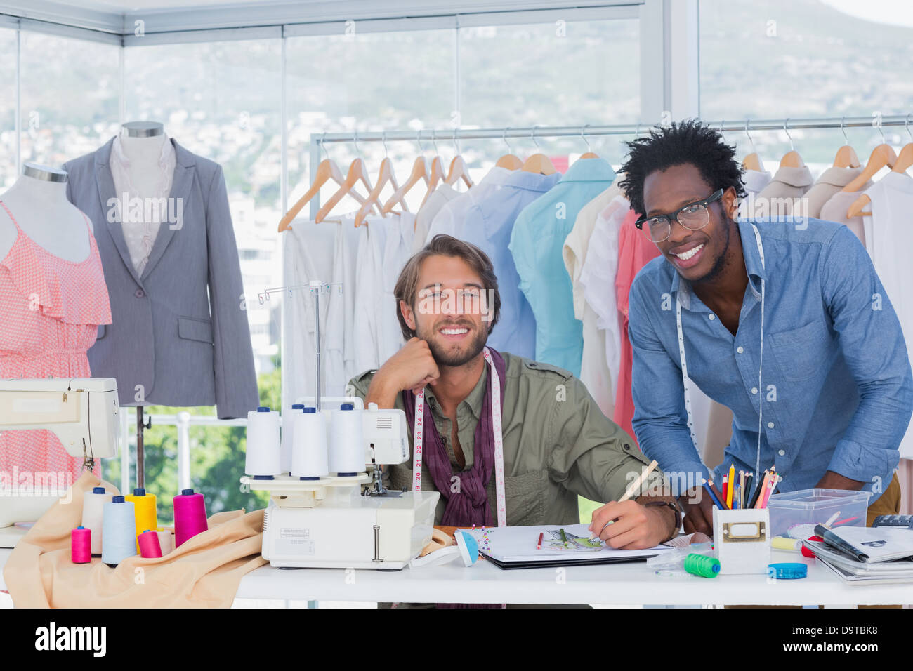 Fashion designers working together in a creative office Stock Photo - Alamy