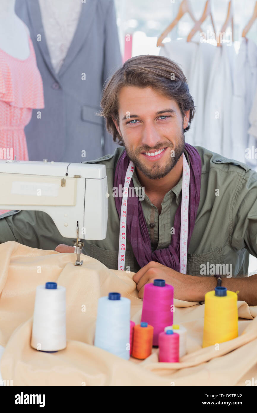 Fashion designer using sewing machine Stock Photo - Alamy
