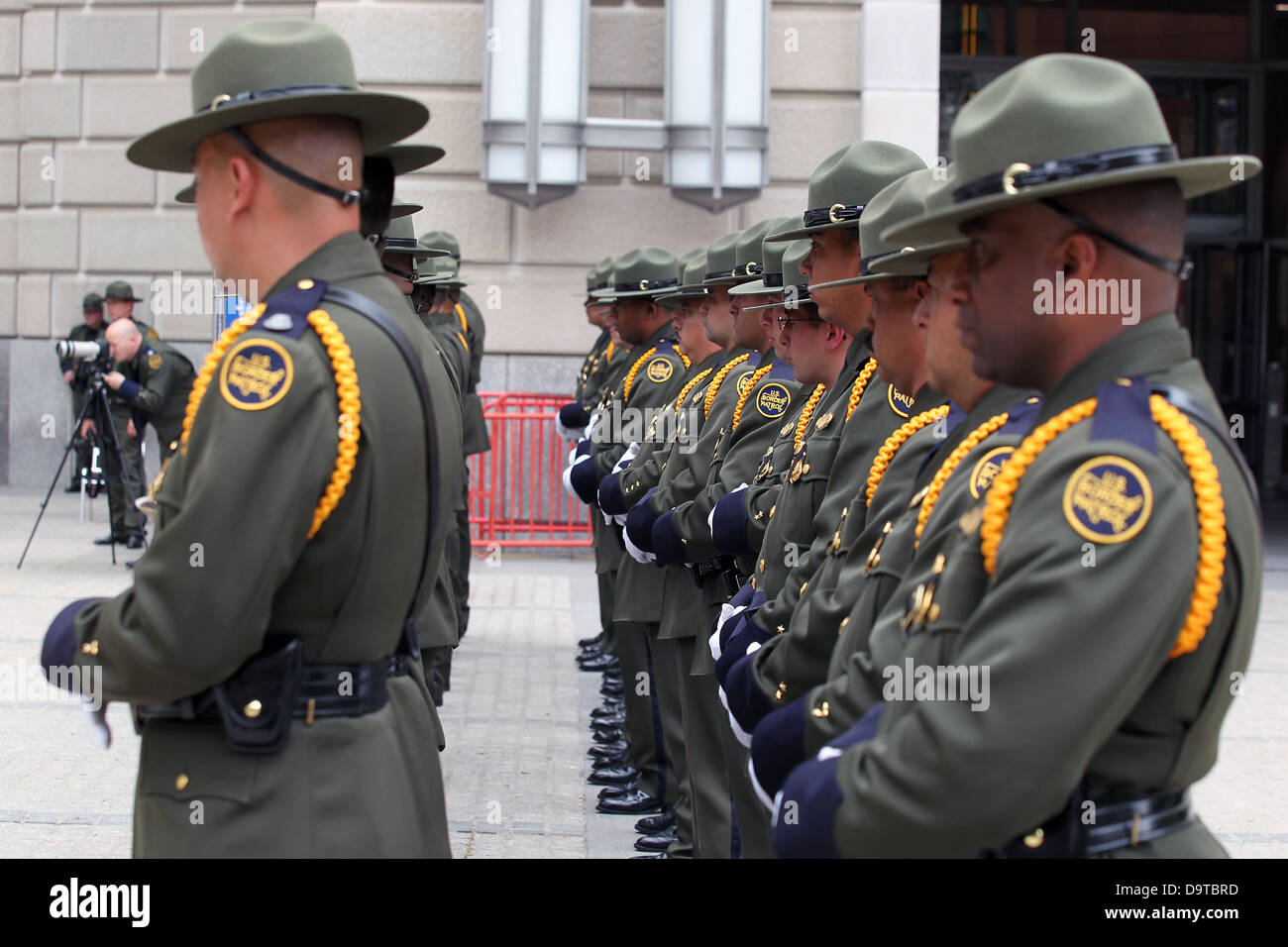 This photograph shows U.S. Customs and Border Protection officers ...
