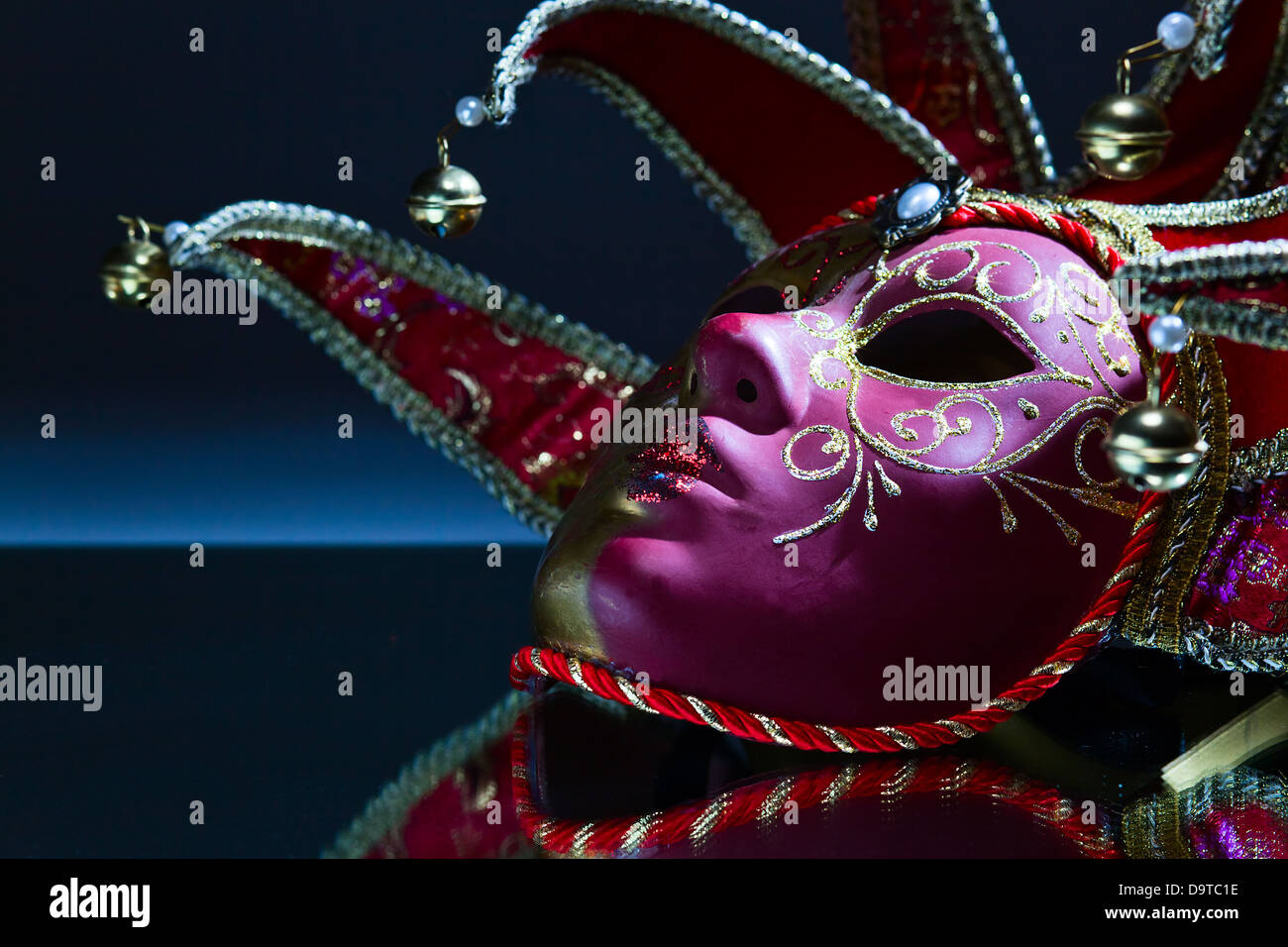 The Venetian mask with bells on a mirror table Stock Photo - Alamy