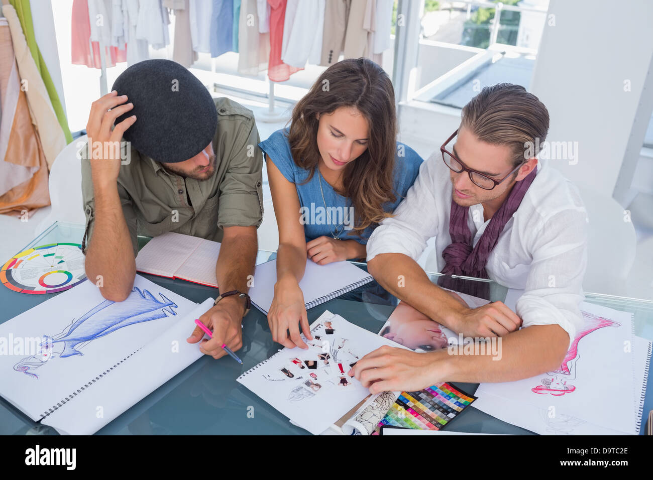 Three fashion designers working together Stock Photo - Alamy