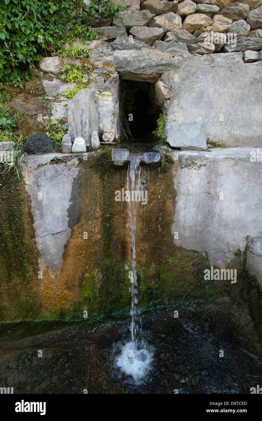 A spring of fresh drinking water emerges from a hillside in the Budhil ...