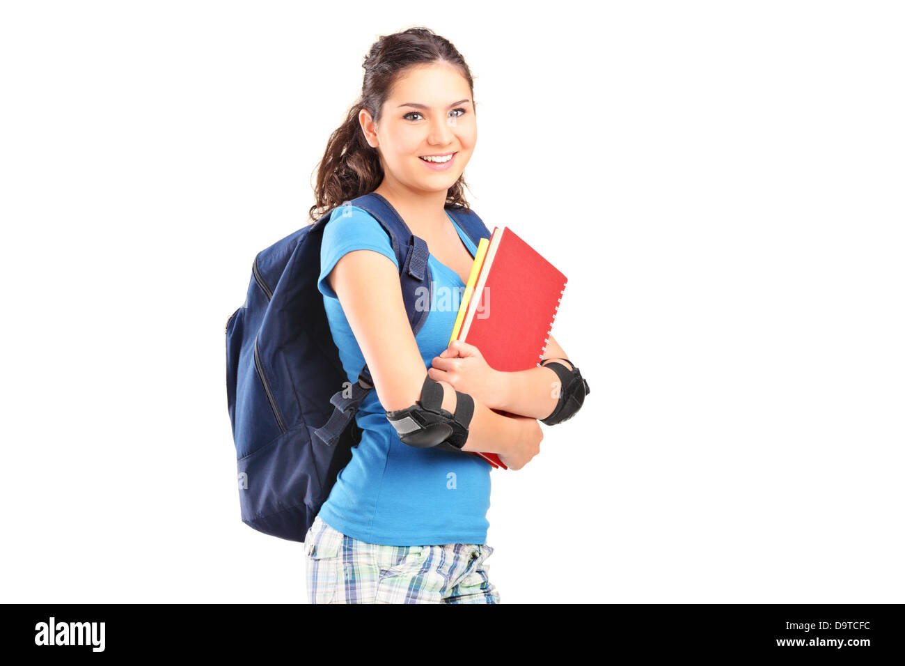 Female student holding books Stock Photo - Alamy