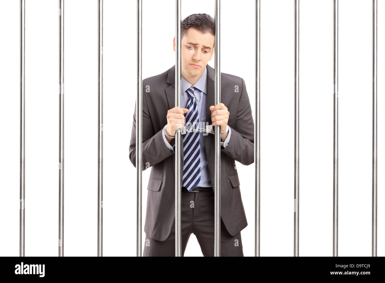 Man standing behind bars holding hi-res stock photography and images ...