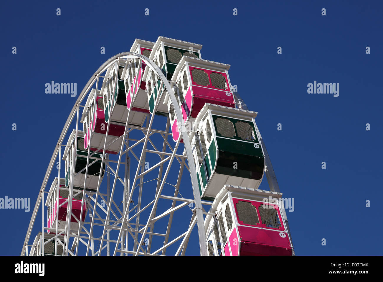 Colorful ferris wheel at a summer fairground Stock Photo - Alamy
