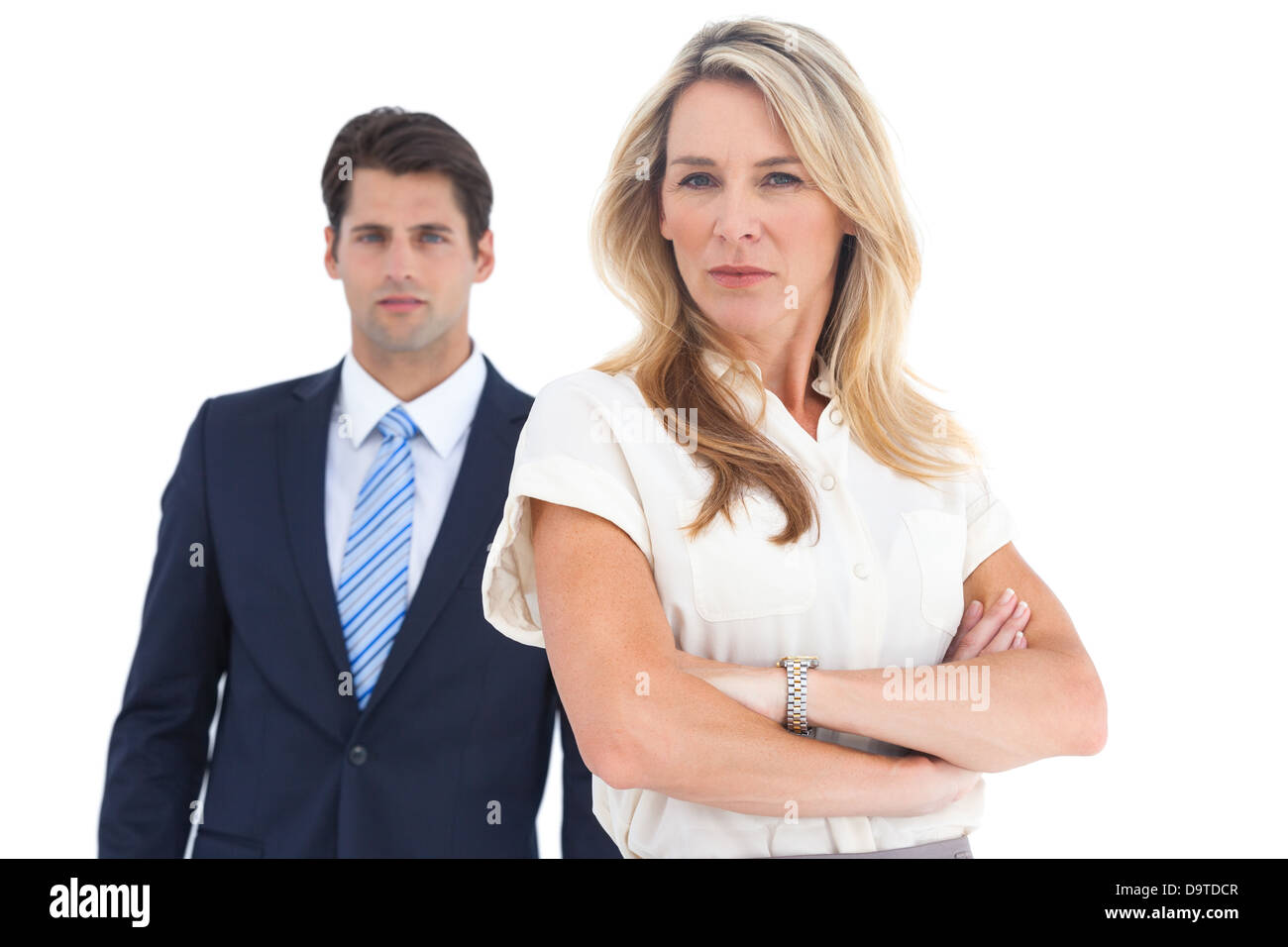 Serious team looking camera crossed hi-res stock photography and images ...