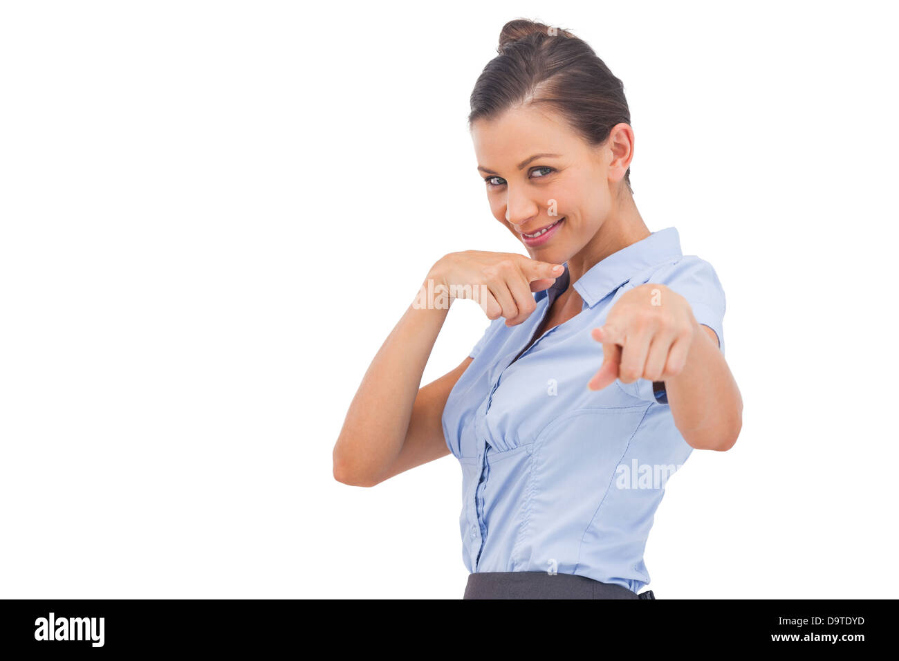 Smiling businesswoman pointing something with fingers Stock Photo - Alamy