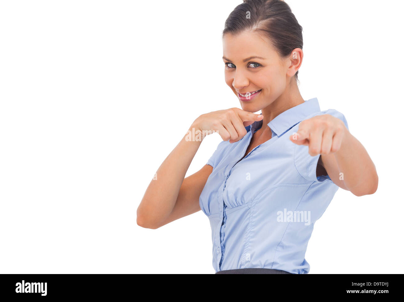Smiling businesswoman pointing out Stock Photo - Alamy