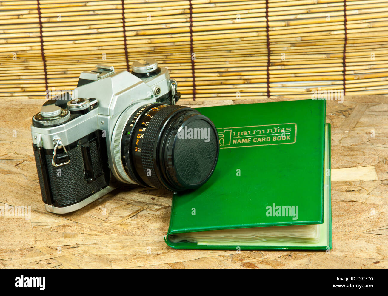 Old camera is placed on name card book Stock Photo - Alamy