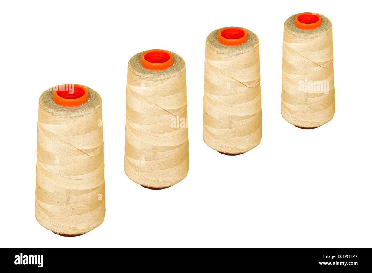 four spool of thread isolated on white background Stock Photo - Alamy