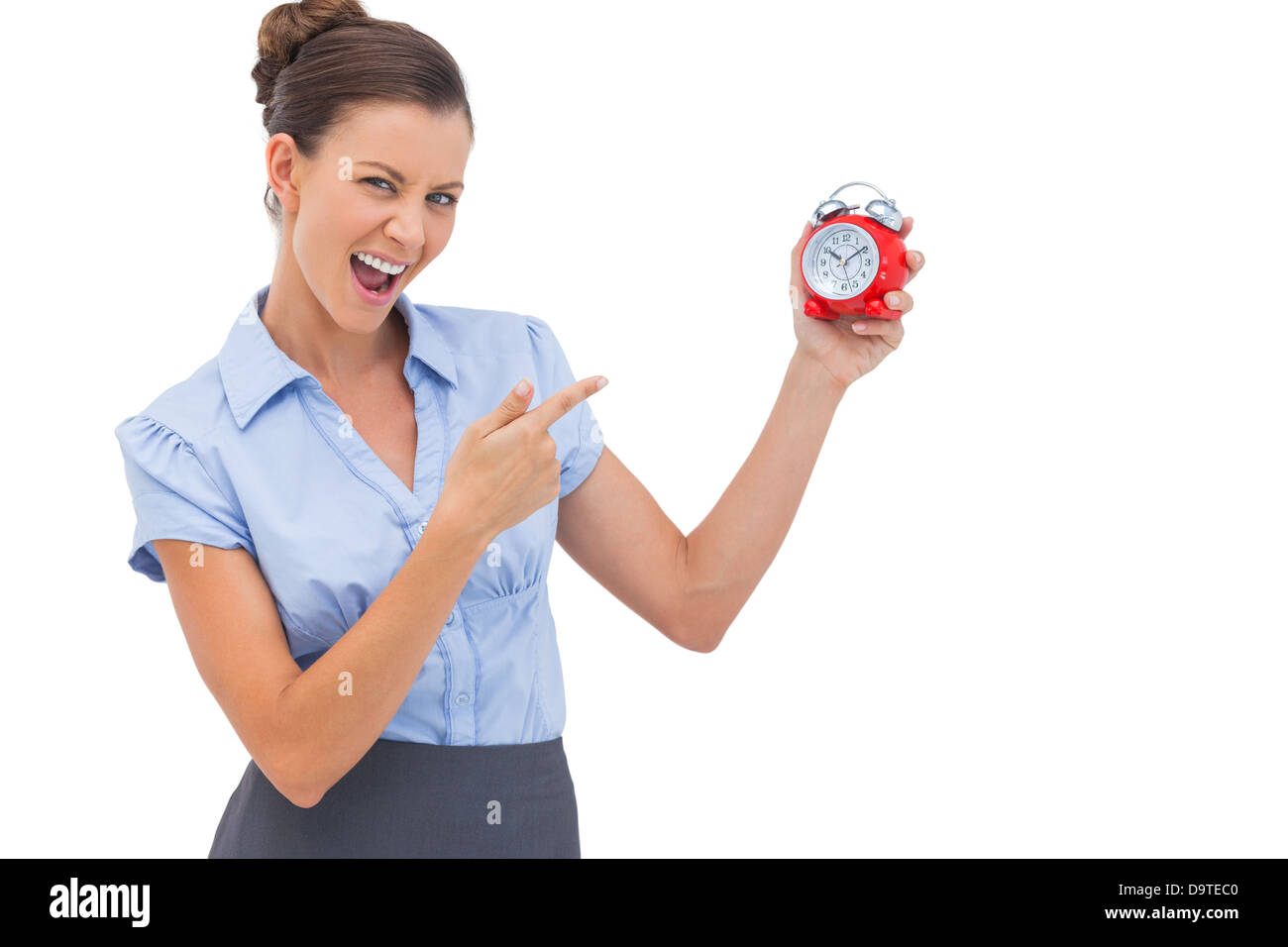 Businesswoman pointing at alarm clock Stock Photo - Alamy Businesswoman pointing at alarm clock Stock Photo - Alamy