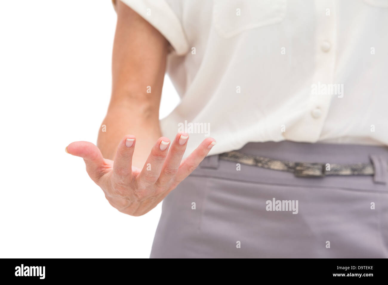 Businesswoman presenting her hand Stock Photo - Alamy