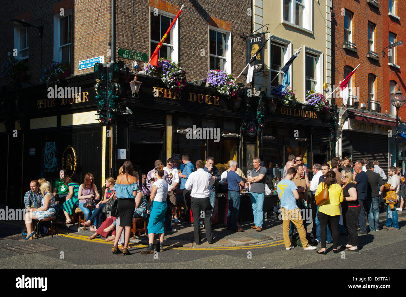People standing outside The Duke pub Duke Street central Dublin Ireland ...