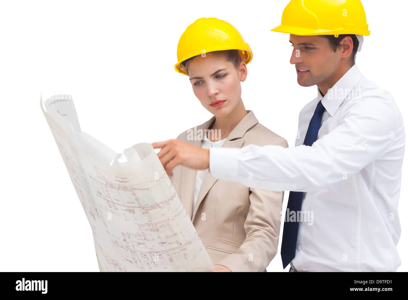 Serious architects looking at construction plan Stock Photo - Alamy