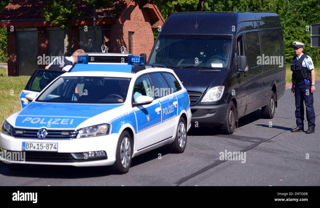 Police officers check a car at autobahn A7 near Flensburg, Germany, 07 ...