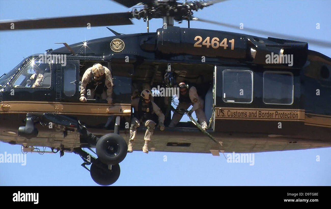 This photograph captures a U.S. Customs and Border Protection Blackhawk ...