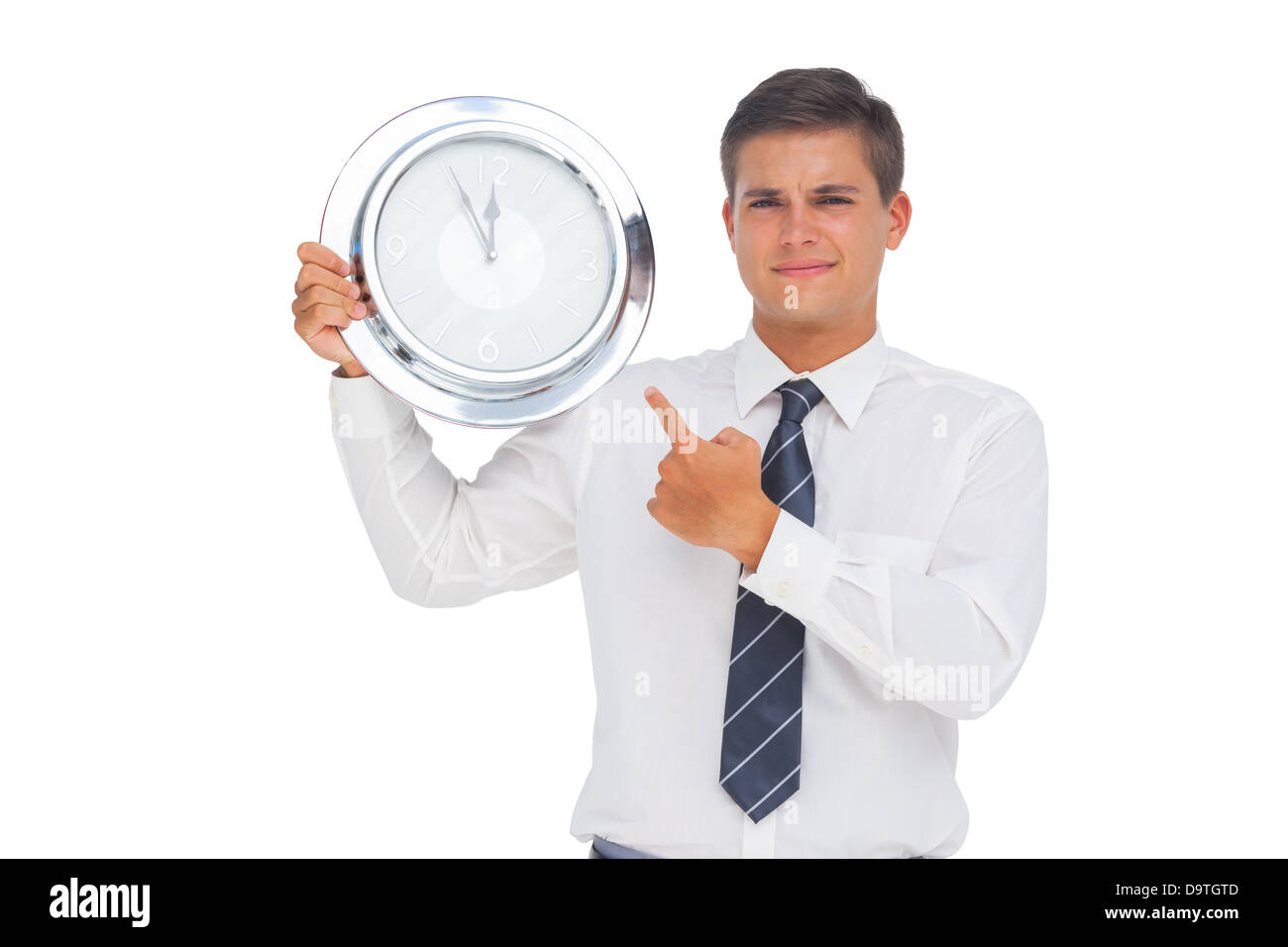 Businessman holding and showing a clock Stock Photo - Alamy