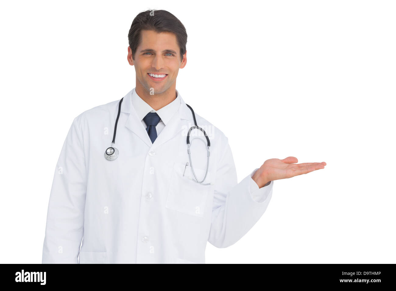 Happy doctor showing something and smiling Stock Photo - Alamy