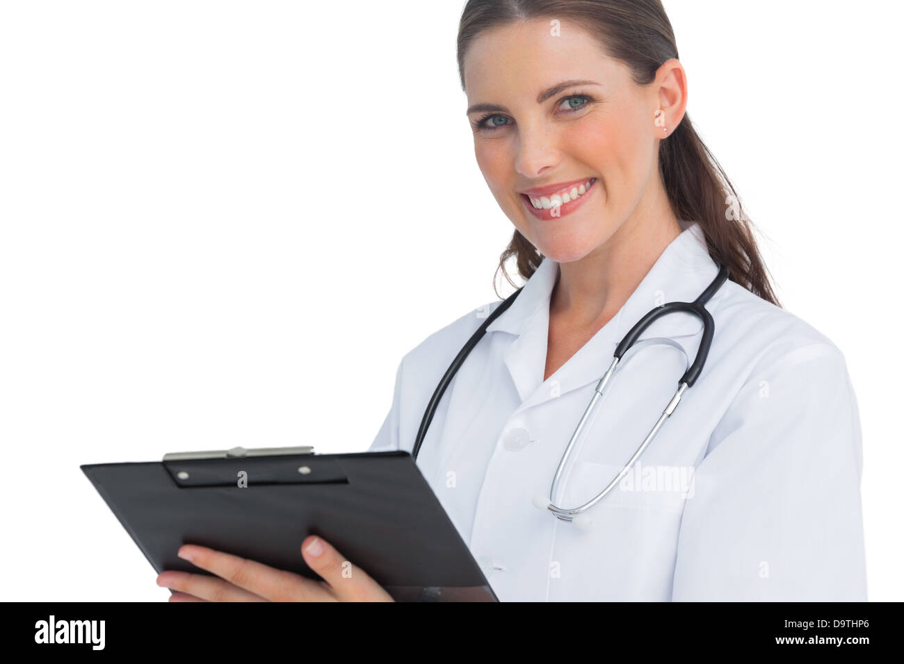 Happy nurse smiling at camera and holding clipboard Stock Photo - Alamy