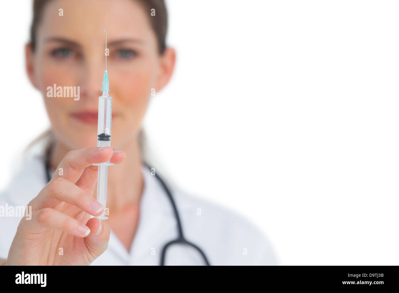Nurse holding a syringe up Stock Photo - Alamy