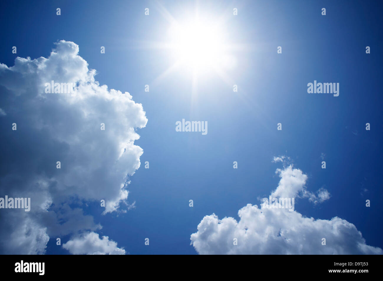 Blue sky with clouds and sun Stock Photo - Alamy
