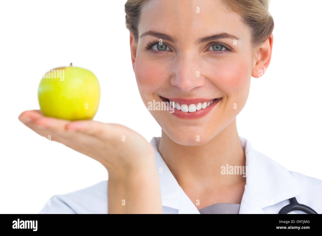 Nurse with apple in her hand Stock Photo - Alamy