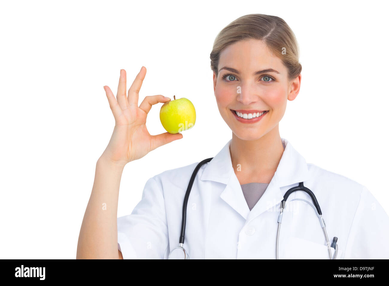 Nurse showing apple Stock Photo - Alamy
