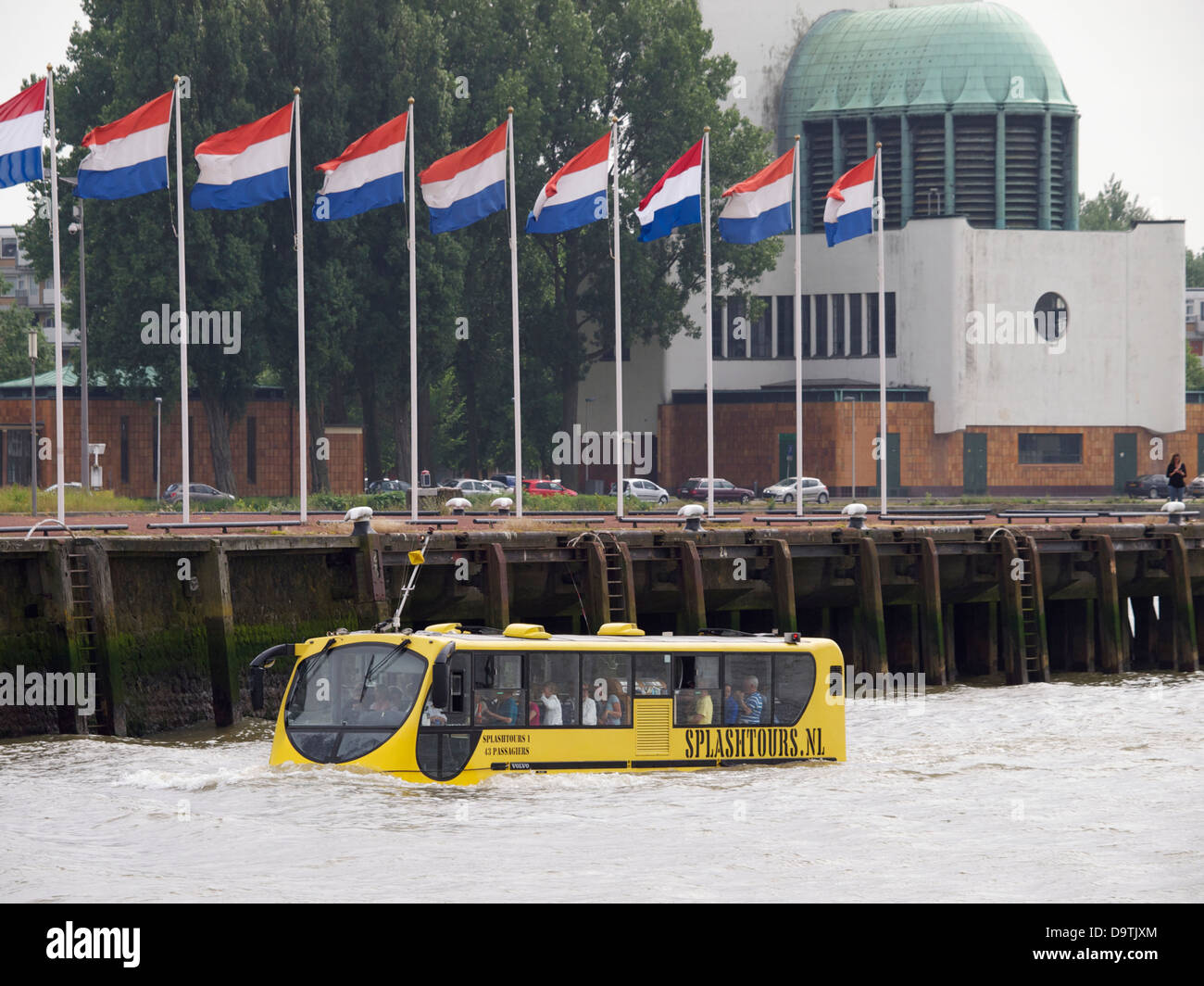 Amphibious tourist bus sailing on the Maas river in the city center of ...