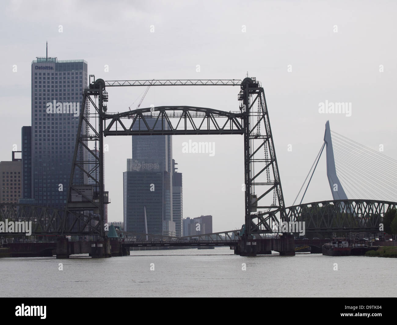 old and new bridges silhouetted in the city centre of Rotterdam, the ...