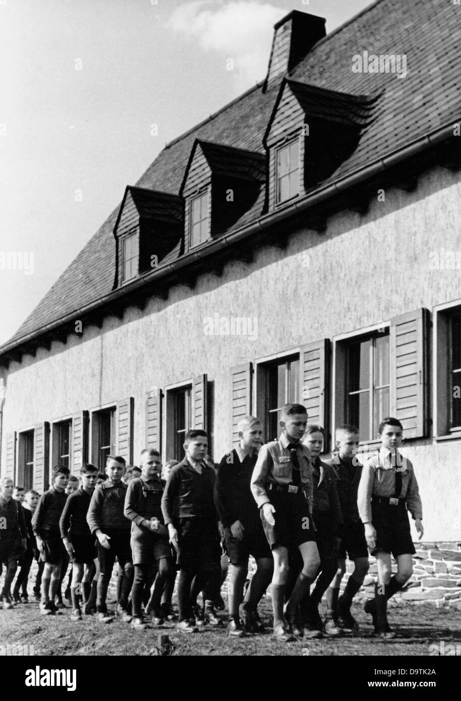 Boys of the German Youth are practicing the march in lockstep in front ...
