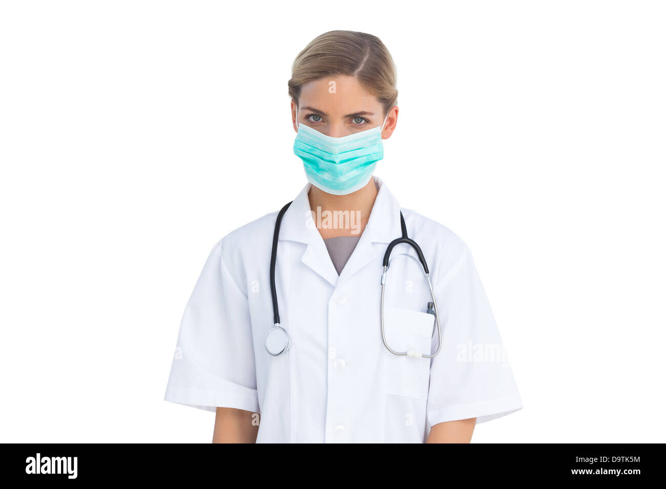 Serious nurse wearing surgical mask Stock Photo - Alamy