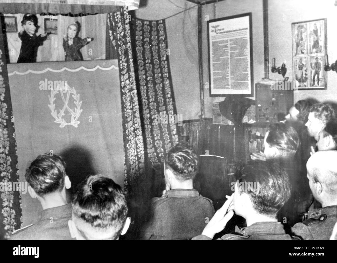 Soldiers are pictured during a Kasperle puppet theater performance as ...