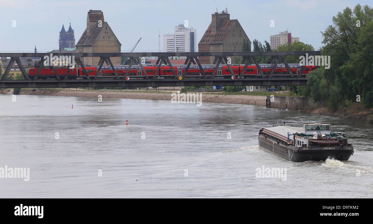 A Deutsche Bahn passenger train crosses the Elbe River in Magdeburg ...