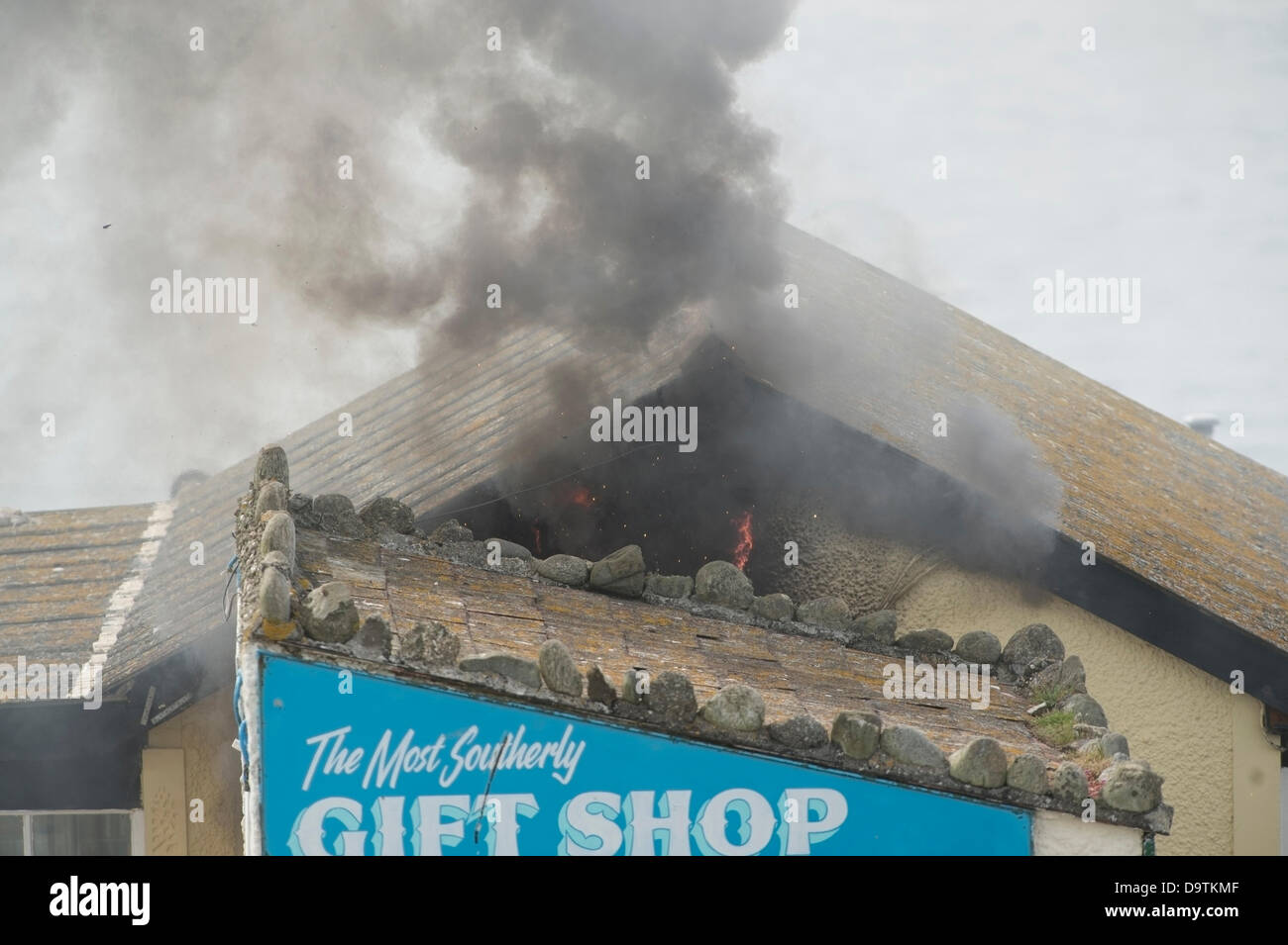 Electrical Fire at Polpeor cafe, smoke and flame rising from the side ...