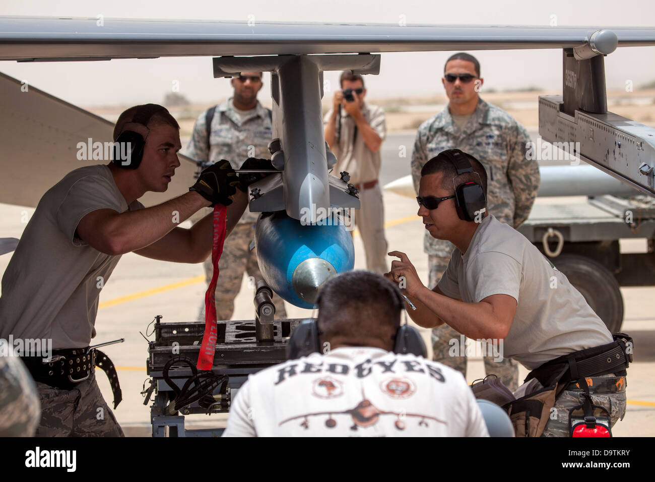 During a practice munitions loading competition, members from the ...