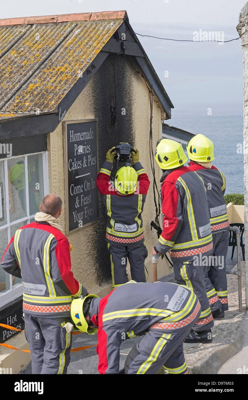 Electrical Fire at Polpeor cafe, firemen inspect for hot spots using a ...