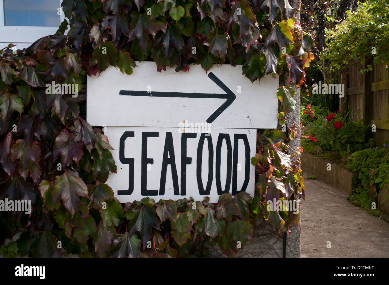 Sign saying seafood outside a restaurant in Morthoe, North Devon ...