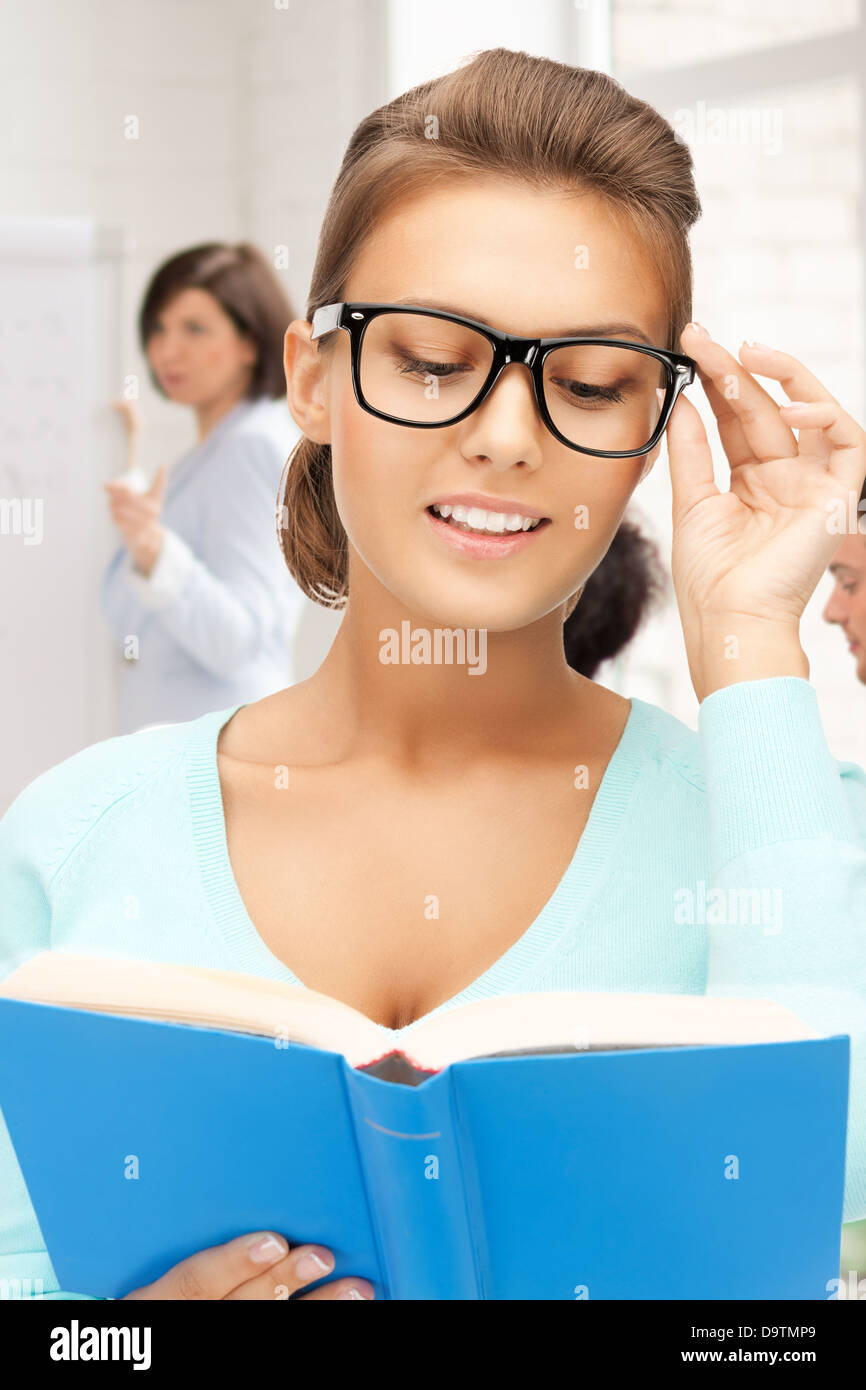 smiling student girl reading book at school Stock Photo - Alamy