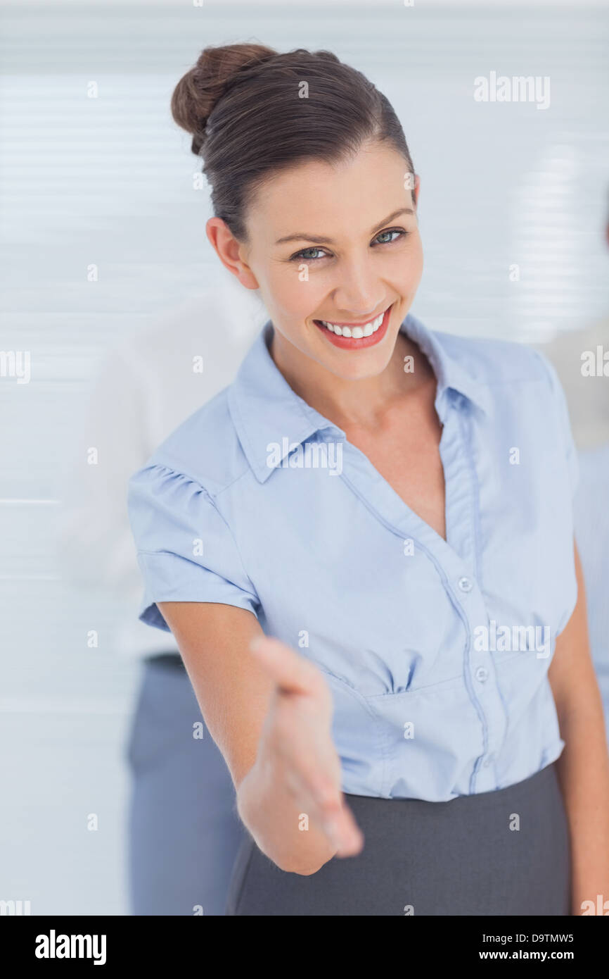 Business woman giving her hand for handshake Stock Photo - Alamy