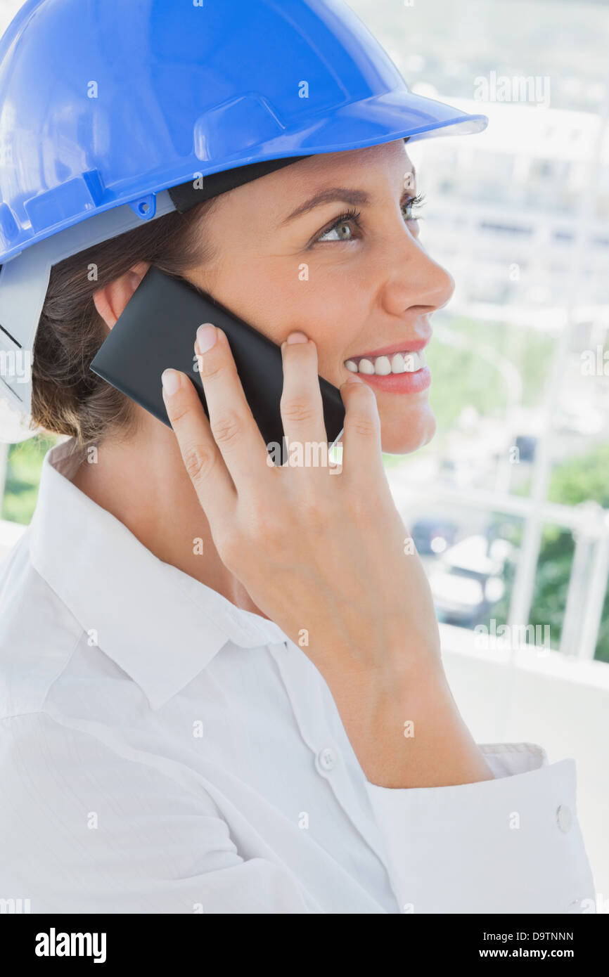Smiling architect having a phone conversation Stock Photo - Alamy