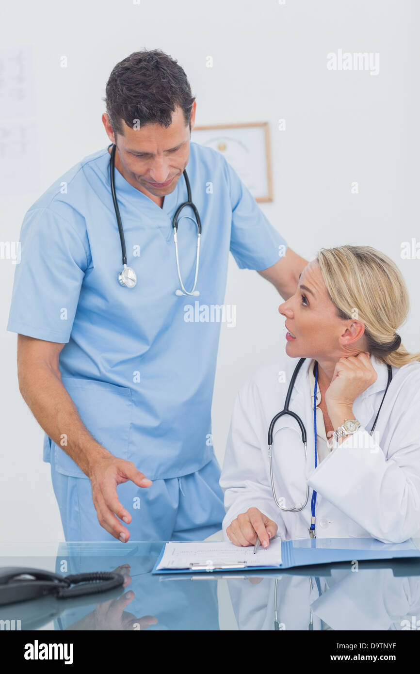 Team of doctors discussing together Stock Photo - Alamy