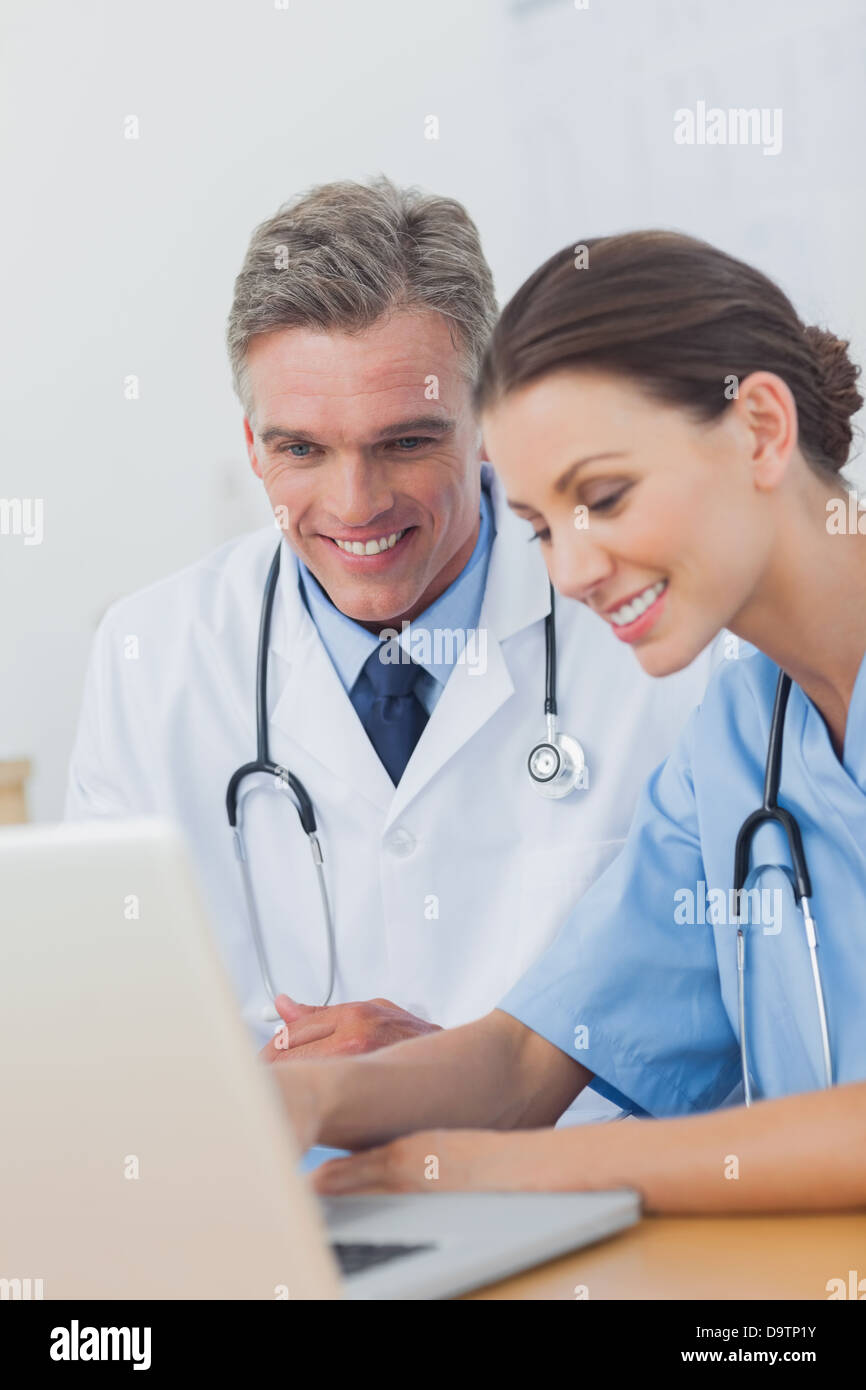 Cheerful female doctor working on hi-res stock photography and images ...
