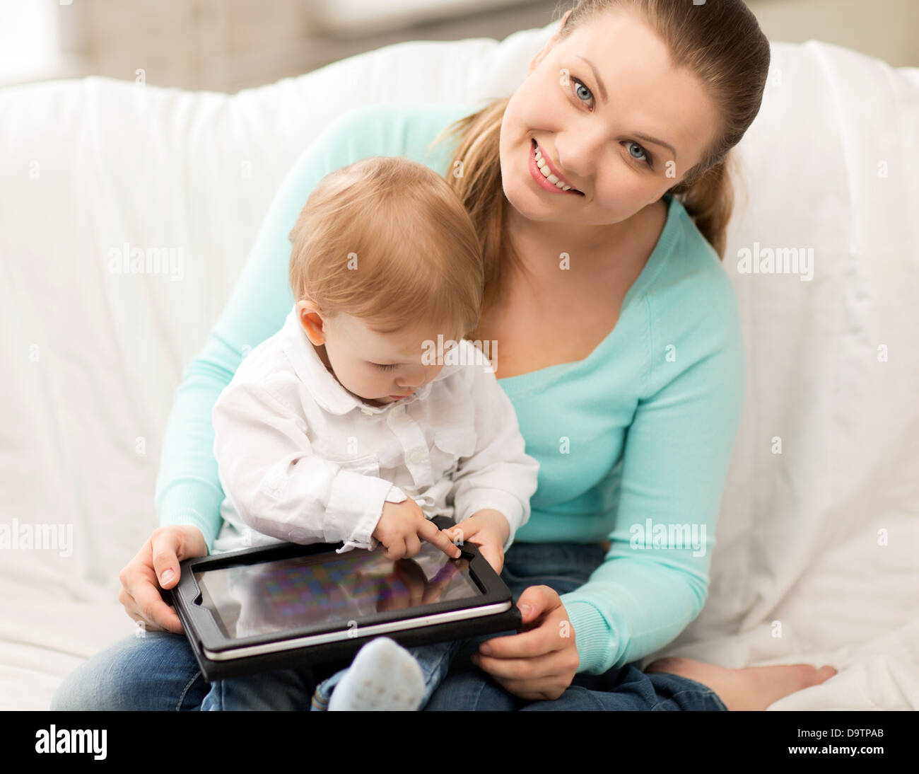 mother and adorable baby with tablet pc Stock Photo - Alamy