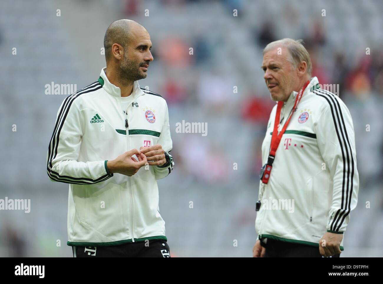 FC Bayern Munich's head coach Pep Guardiola (L) talks with assistant ...