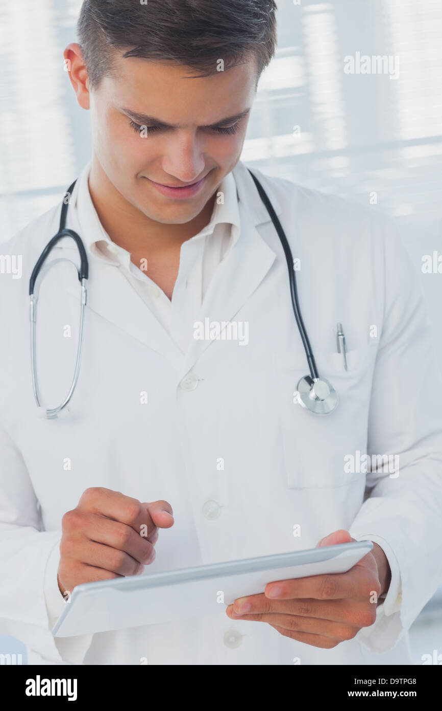 Young doctor using tablet Stock Photo - Alamy