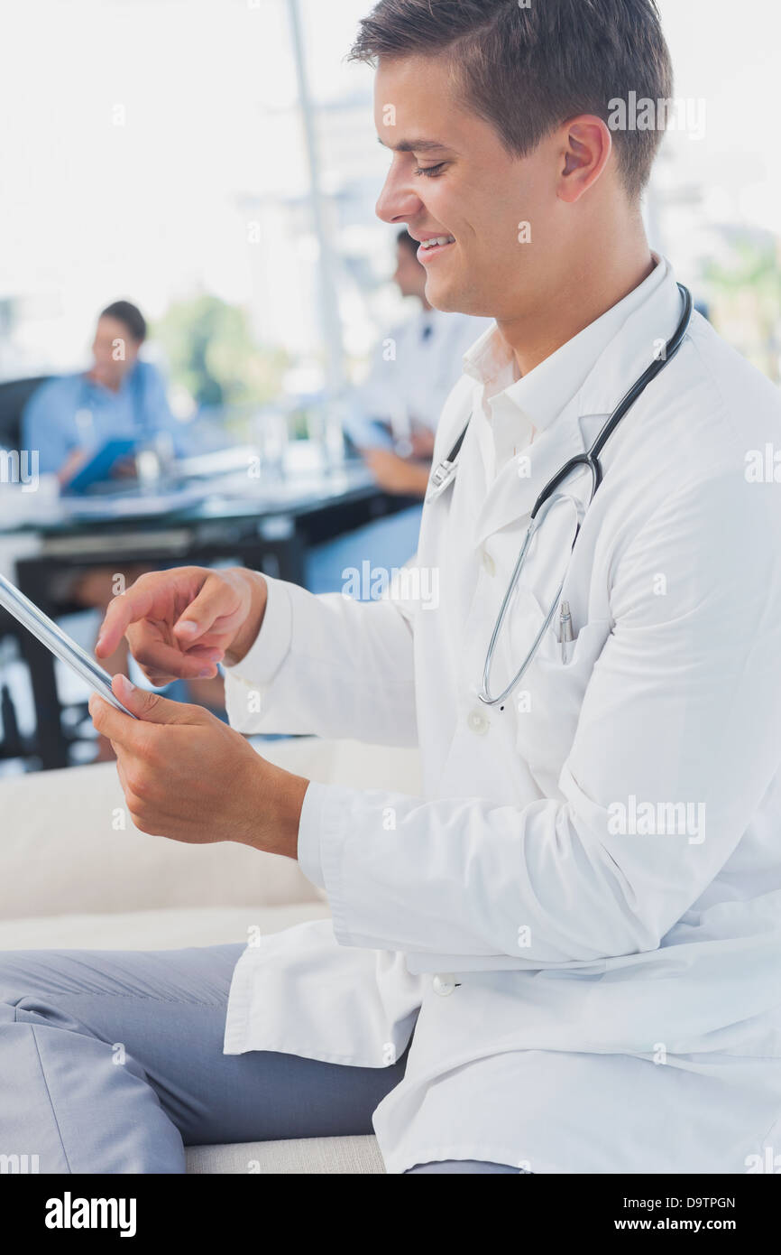 Doctor using tablet pc Stock Photo - Alamy