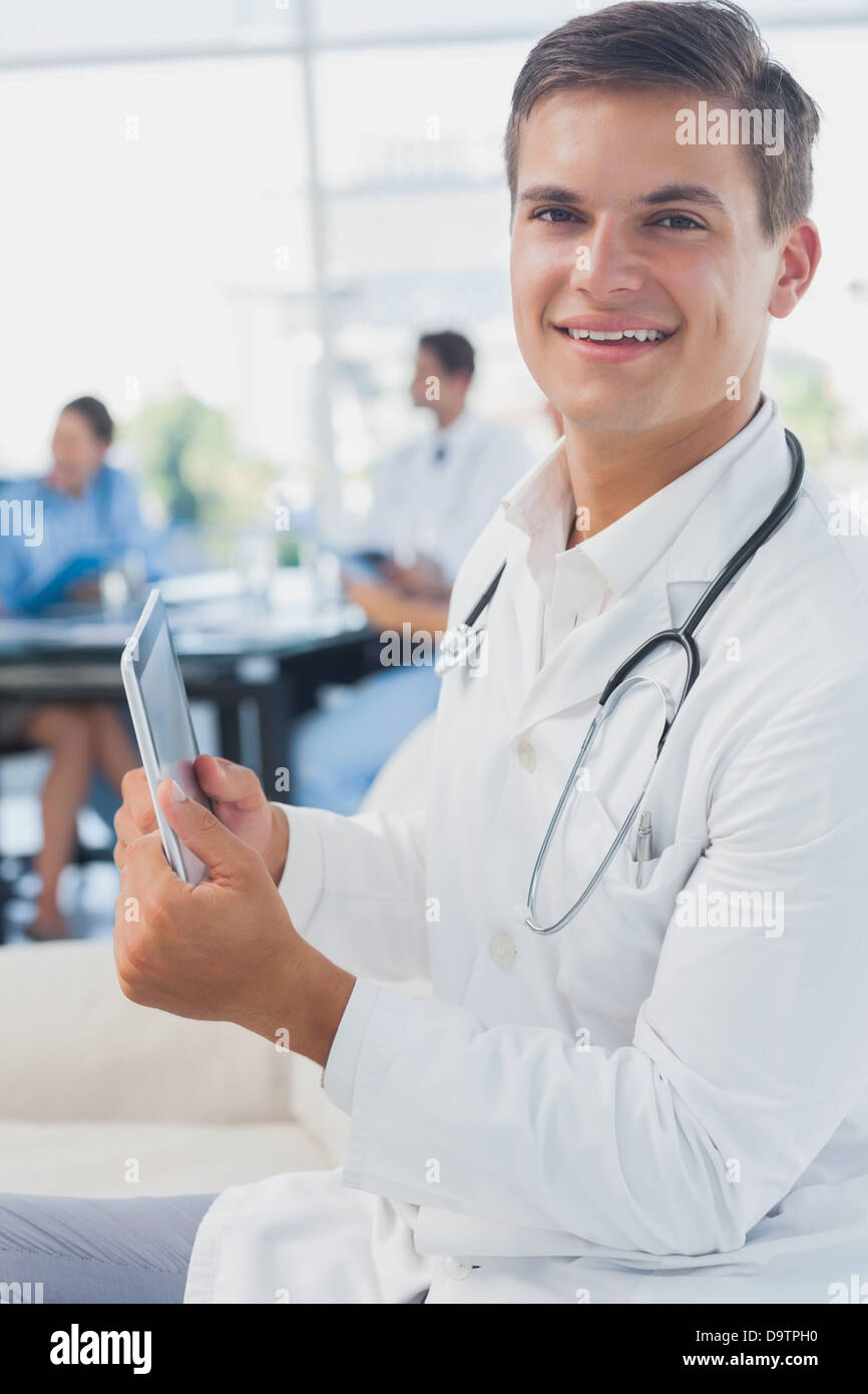 Doctor with computer looking at camera hi-res stock photography and ...